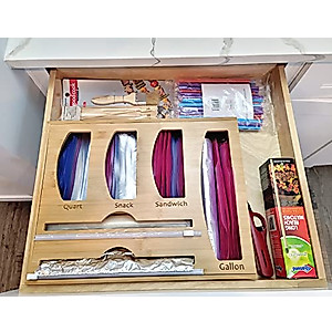 Redesigned and OVERSIZED ZipLock Bag storage organizer with plastic wrap and aluminum foil dispenser with cutter. 4 slots - Quart, Sandwich, Freezer and Gallon size.