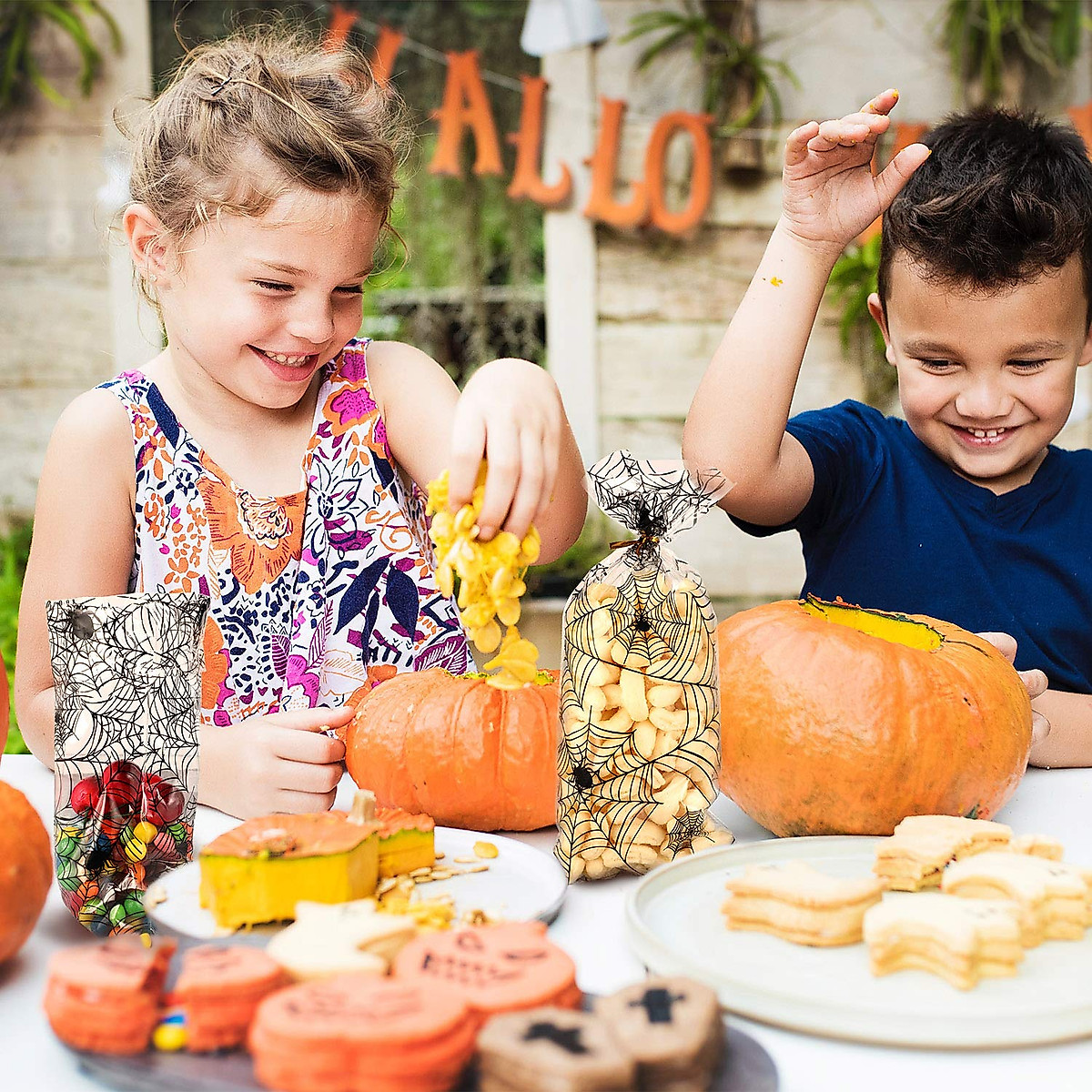 Boao 150 Pcs Halloween Cellophane Treat Bags Clear Plastic Candy Bags with 150 Twist Ties 11 Inch Pumpkin Spider Web Halloween Goodie Bags for for Snacks Cookies Gift Kids Halloween Party Favor