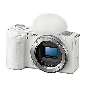 Sony Alpha ZV-E10 APS-C Interchangeable Lens Mirrorless Vlog Camera (Body Only, White) Bundle with Shotgun Microphone, Extendable Tripod with Built-in Phone Mount and Memory Card (4 Items)