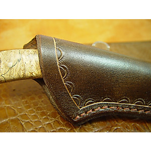 Custom Leather Vertical Knife Sheath. The Sheath Is Made Out of 10 Ounce Water Buffalo Hide Leather with a Border Tooling Dyed Dark Brown. The Sheath Is Made Out of Water Buffalo Leather the Water Buffalo Leather Is Very Soft Pliable and Durable. The Shea