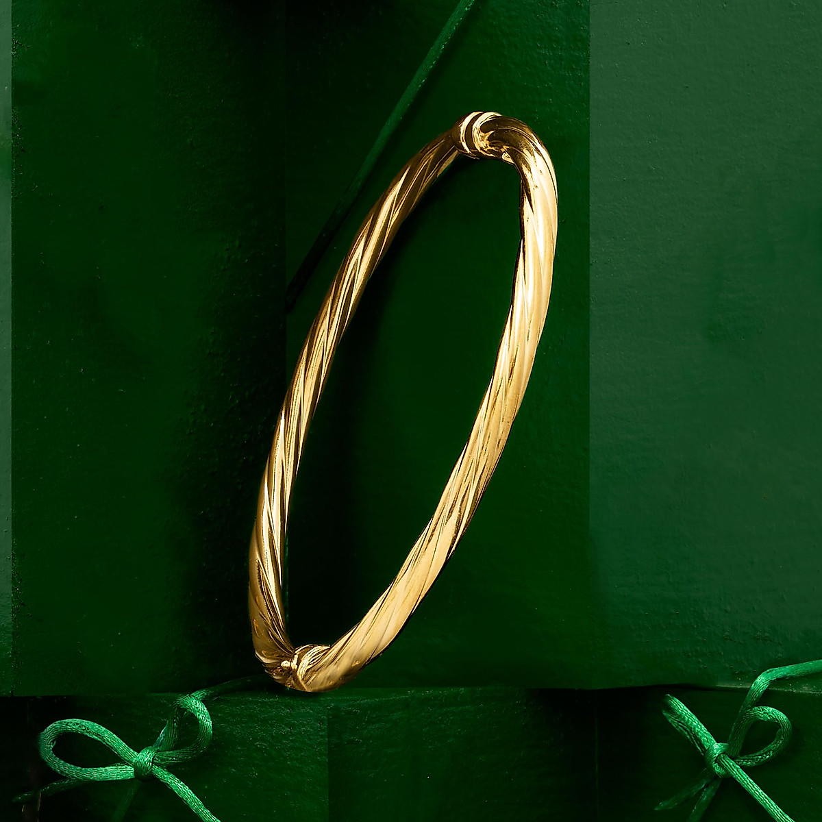 Ross-Simons Italian 4mm 18kt Gold Over Sterling Twisted Bangle Bracelet. 7 inches