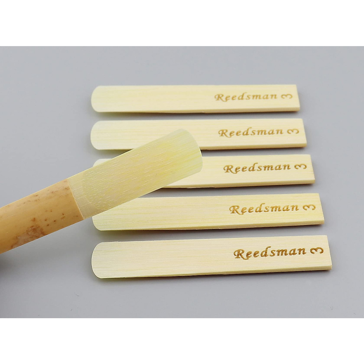 Reedsman Traditional Bb Clarinet Reeds, Includes 10 Plus 2 Total 12 Pack Reeds With Individual Reed Holders and One Mini Harmonica. (Strength 3.0)