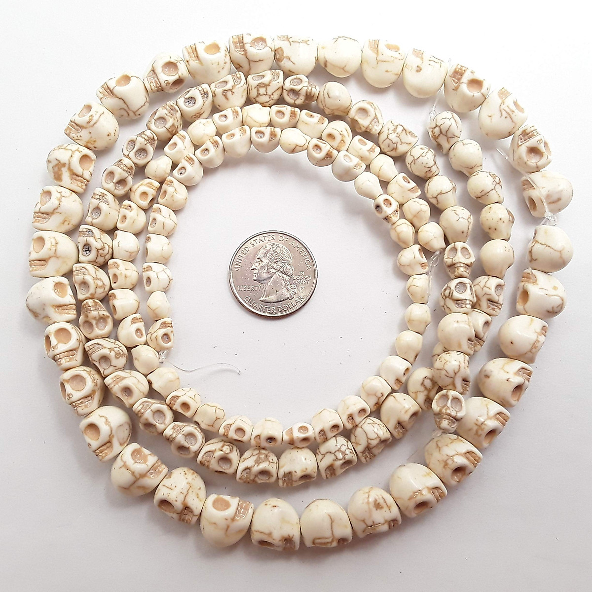 White Magnesite Turquoise Skull Size 6x8mm 15.5" Strand