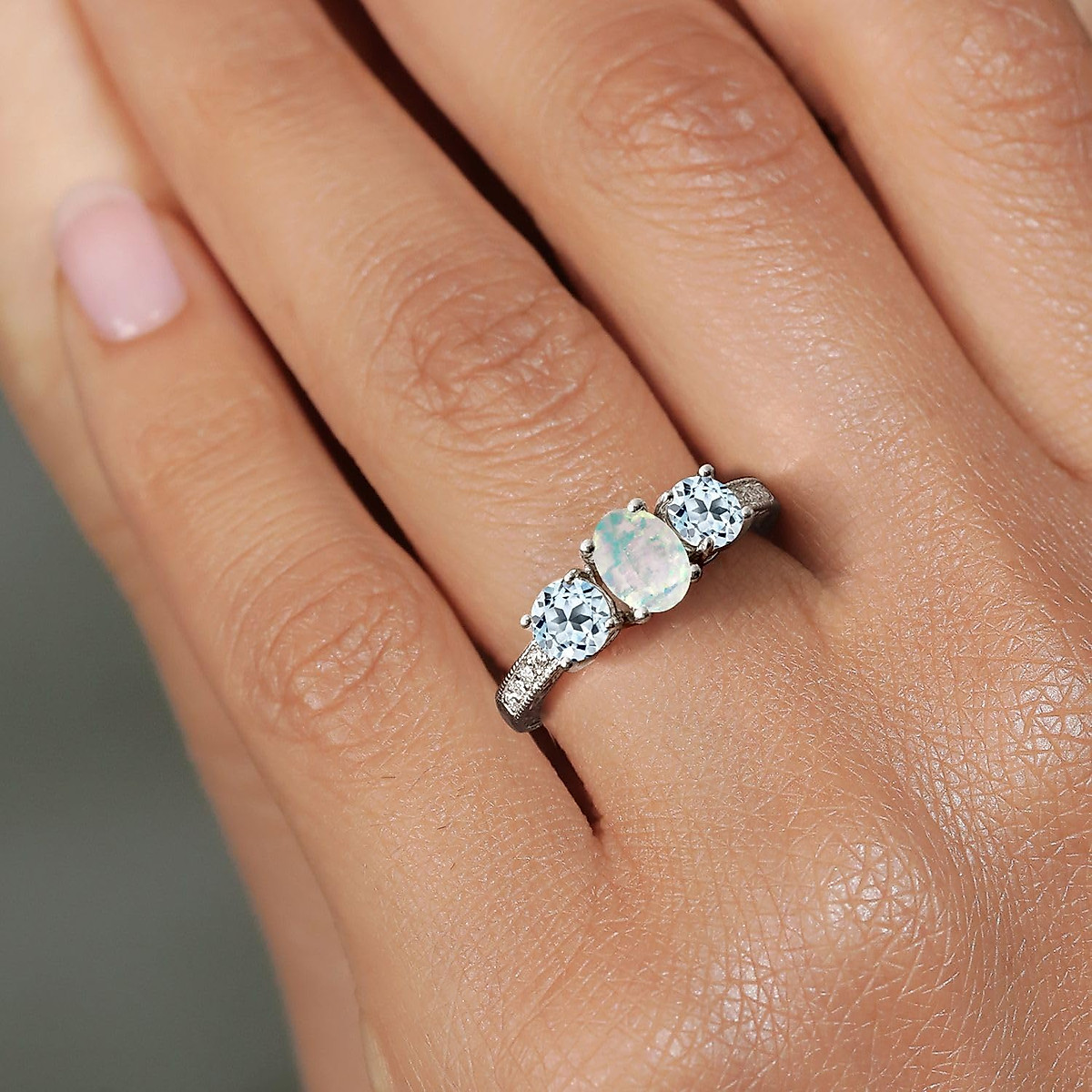 Gem Stone King 925 Sterling Silver White Simulated Opal and Sky Blue Topaz Ring For Women (1.75 Cttw, Oval Gemstone Birthstone, Available In Size 5, 6, 7, 8, 9)