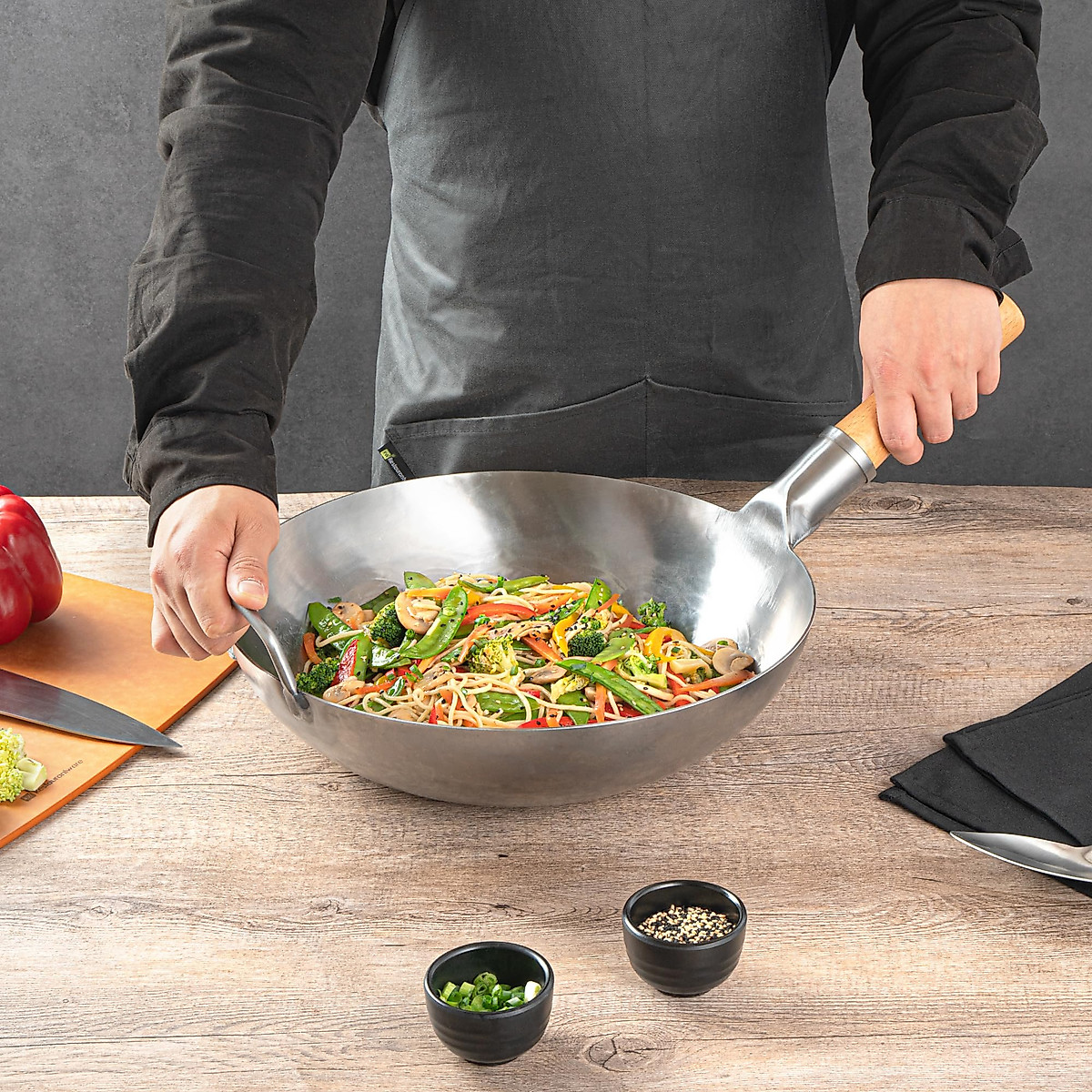 Restaurantware-Motomori 13.38 Inch Hand-Hammered Carbon Steel Wok, 10 Traditional Japanese Wok - Flat Bottom, Wooden Handle, Black Carbon Steel Traditional Stir Fry Pan, With Helper Handle