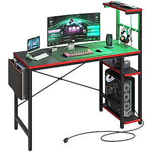 Bestier Gaming Desk with Power Outlets, 44 Inch Led Gamer Desk with 4 Tiers Reversible Shelves, PC Gaming Table with Headset Hook & Side Storage Bag for Bedroom (Black 3D Carbon Fiber)