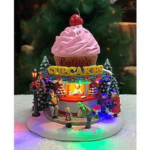 MOMENTS IN TIME Christmas Village Building, Cupcake Shop with LED Lights and Christmas Music - Battery Operated (not Included) (10.4" H x 9.5" W x 7.5" D)