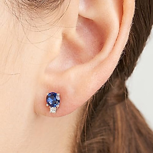 Amazon Essentials Platinum Over Sterling Silver Created Blue Sapphire and 1/10th Carat Total Weight Lab Grown Diamond Two Stone Stud Earrings (previously Amazon Collection)