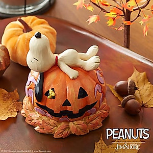 Enesco Peanuts by Jim Shore Halloween Snoopy Laying on Carved Pumpkin Figurine, 5.5 Inch, Multicolor