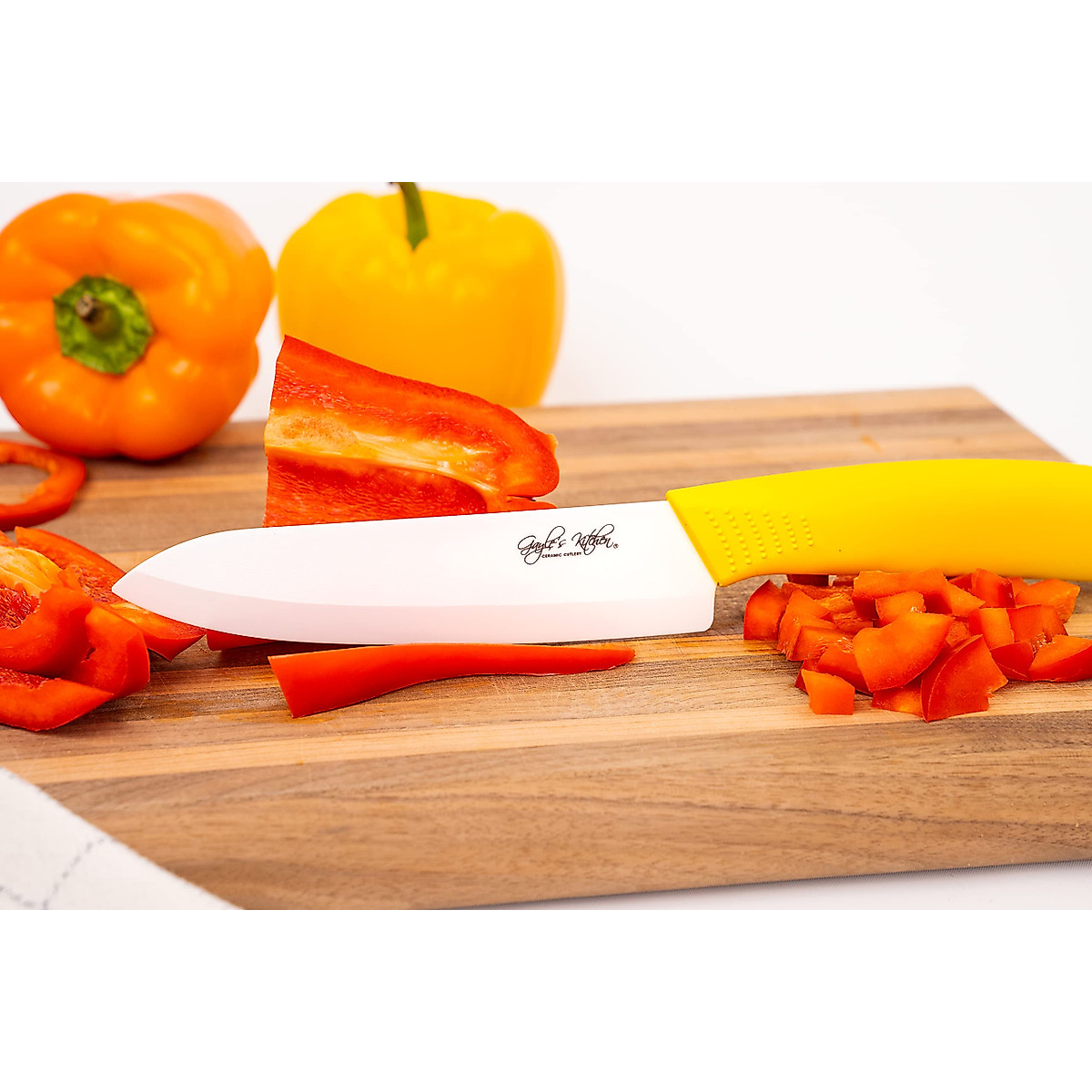 Serrated Black Ceramic Knife Set with 5" Serrated Knife. Includes 3”, 4”, 5”, 6” Ceramic Knives, Matching Sheaths and a Matching Vegetable Peeler in a Black Gift Box