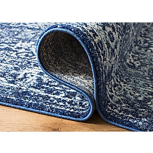 SAFAVIEH Evoke Collection Area Rug - 6'7" x 9', Navy & Ivory, Oriental Distressed Design, Non-Shedding & Easy Care, Ideal for High Traffic Areas in Living Room, Bedroom (EVK256A)