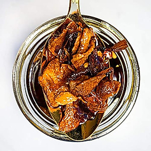 Hot Crispy Oil, An all natural unique blend of fresh fried shallots, fresh garlic and a proprietary blend of three different chili peppers. Highly addictive.