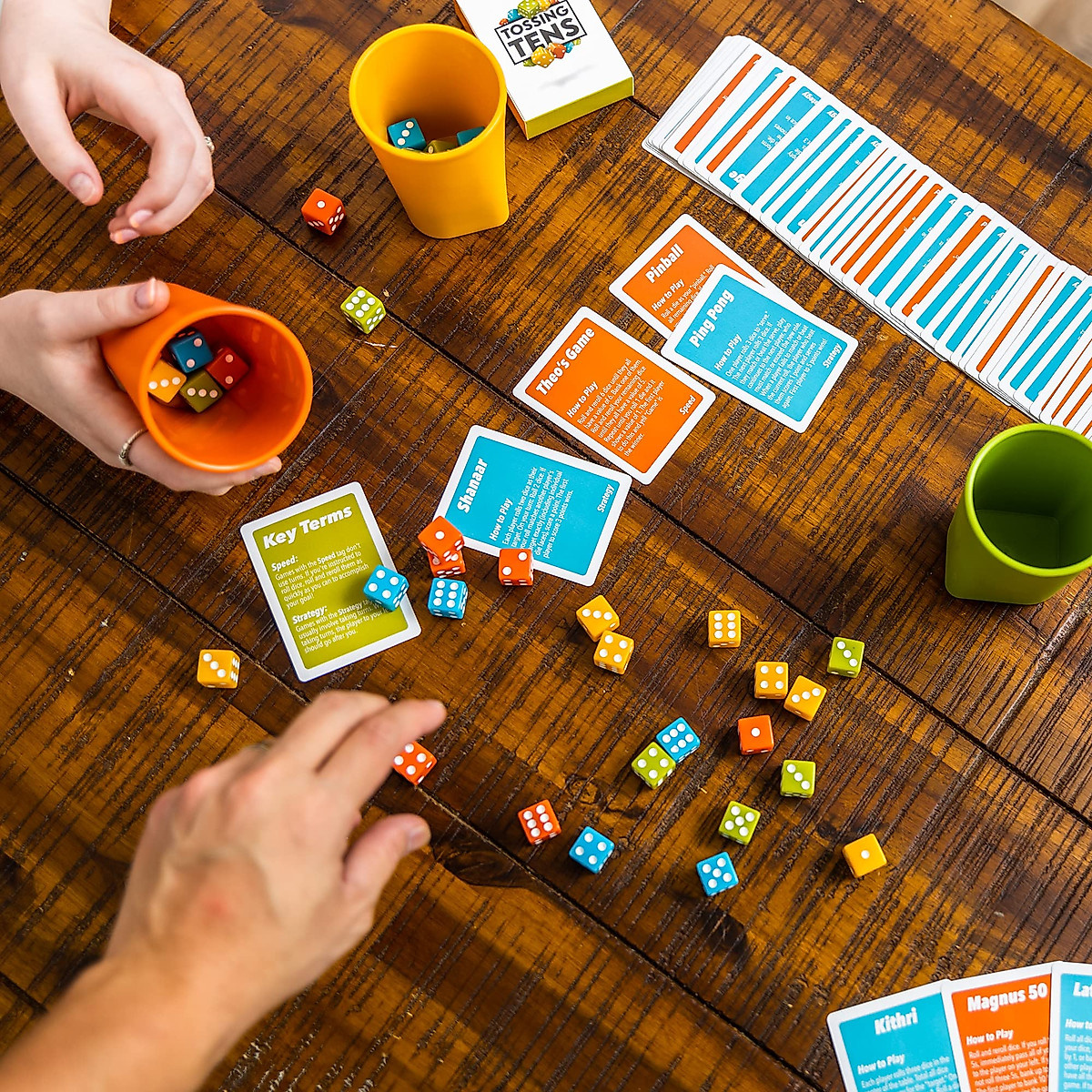 Tossing Tens - 50+ Fast, Frenzied Dice Games and 40 Colorful Dice - Included Deck of Unique Dice-chucking Activities for Game Night, 1-4 Players, Quick Play Time, Math Games (Deluxe w/Dice Cups)