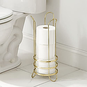 mDesign Decorative Free Standing Toilet Paper Holder Stand with Storage for 3 Rolls of Toilet Tissue - for Bathroom/Powder Room - Holds Mega Rolls - Durable Metal Wire - Soft Brass