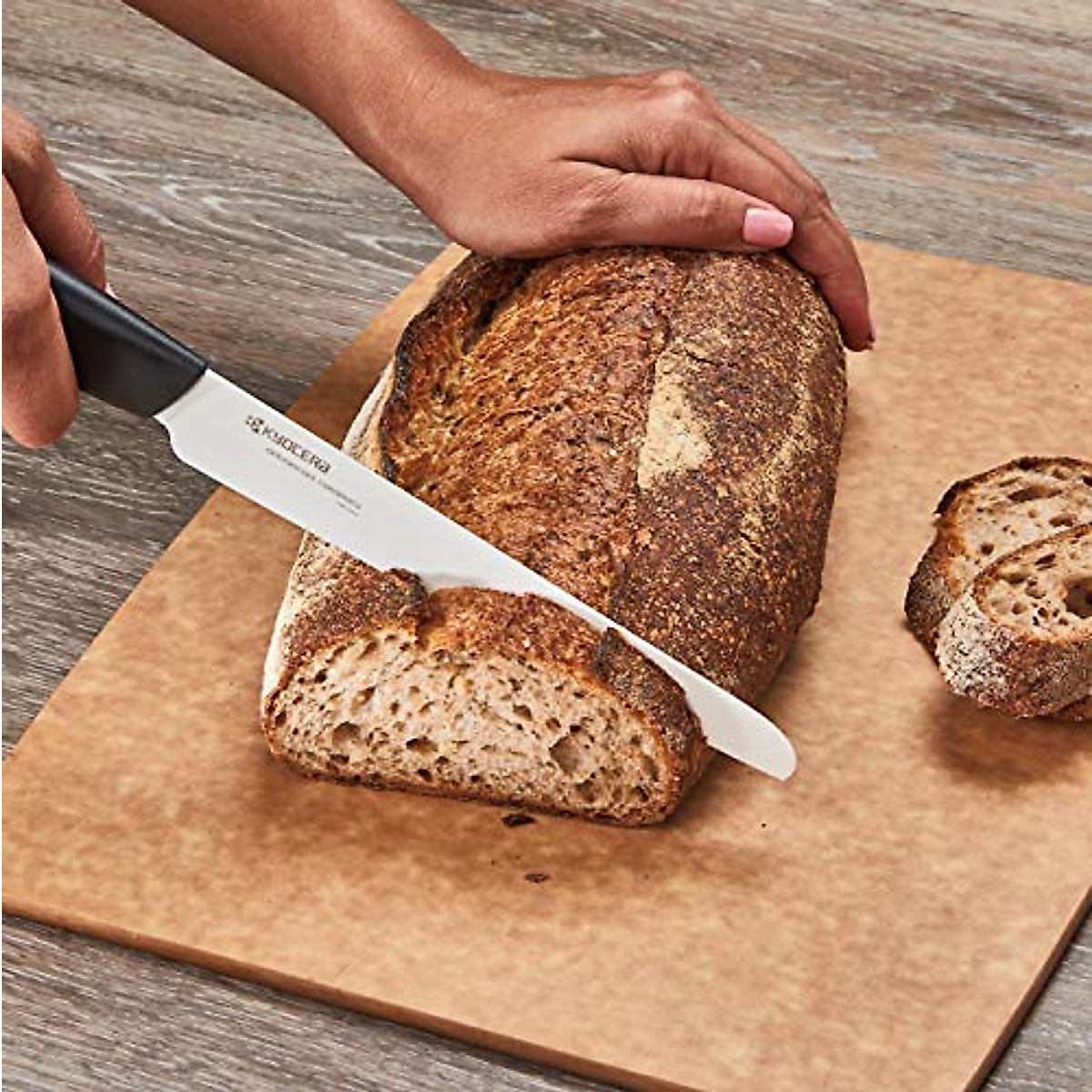 Kyocera Advanced Ceramic Revolution Series 7-inch Serrated Slicing Bread Knife, Black Handle, White Blade