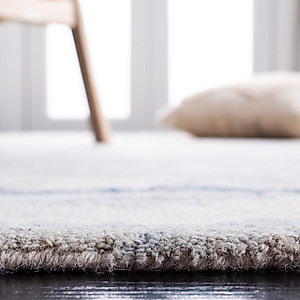 SAFAVIEH Abstract Collection Area Rug - 8' x 10', Ivory & Blue, Handmade Abstract Wool, Ideal for High Traffic Areas in Living Room, Bedroom (ABT465A)