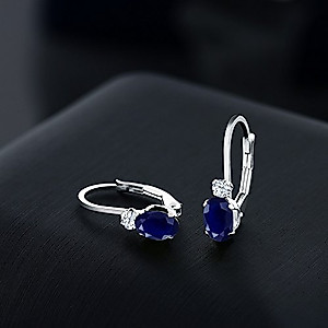 Gem Stone King 925 Sterling Silver Blue Sapphire and White Created Sapphire Leverback Earrings For Women (1.18 Cttw, Gemstone September Birthstone, Oval 6X4MM, Round 2MM, 3/4 Inch)