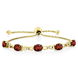 Gem Stone King 18K Yellow Gold Plated Silver Red Garnet and White Lab Grown Diamond Tennis Bracelet For Women (4.37 Cttw, Gemstone January Birthstone, Oval 7x5MM, Fully Adjustable Up to 9 Inch)