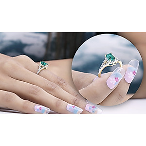 Dazzlingrock Collection 7x5mm Emerald Cut Lab Created Emerald & Round White Diamond Halo Split Shank Engagement Ring for Women in 10K Yellow Gold Size 6