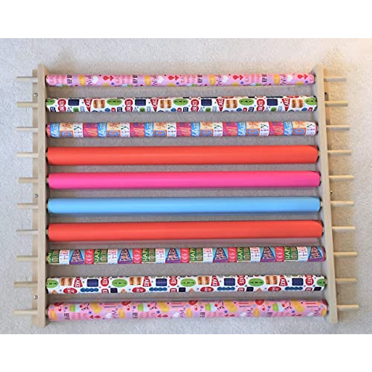 Storage Station, Organizer, Dispensing Rack for Gift Wrapping Paper, Ribbons, Cellophane, Vinyl Rolls, Paper & Other Arts & Crafts Items. Holds 10 Rows. Adjustable Width. Easy Wall Mount. Hardware Included.
