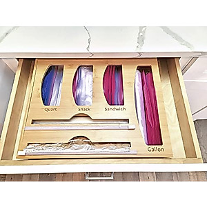 Redesigned and OVERSIZED ZipLock Bag storage organizer with plastic wrap and aluminum foil dispenser with cutter. 4 slots - Quart, Sandwich, Freezer and Gallon size.