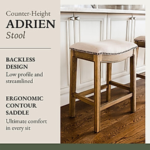 Maven Lane Adrien 26 Inch Counter Height Upholstered Backless Saddle Barstool in Natural Wood Finish with Wheat Cream Fabric Cushion Seat