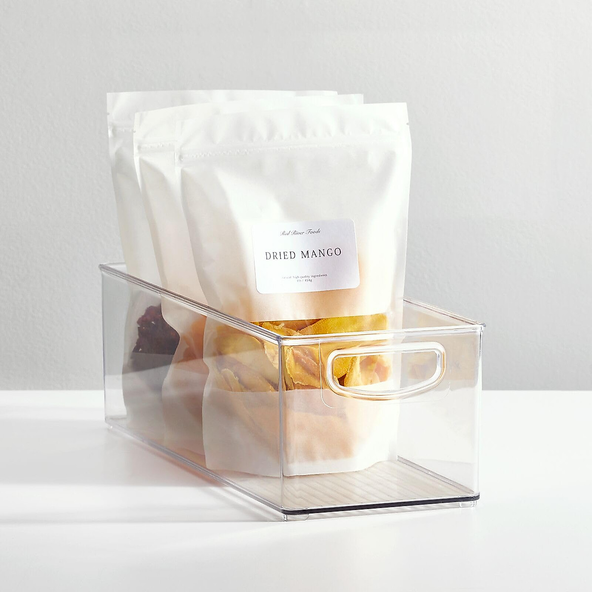 mDesign Plastic Kitchen Organizer - Storage Holder Bin with Handles for Pantry, Cupboard, Cabinet, Fridge/Freezer, Shelves, and Counter - Holds Canned Food, Snacks, Drinks, and Sauces - Clear