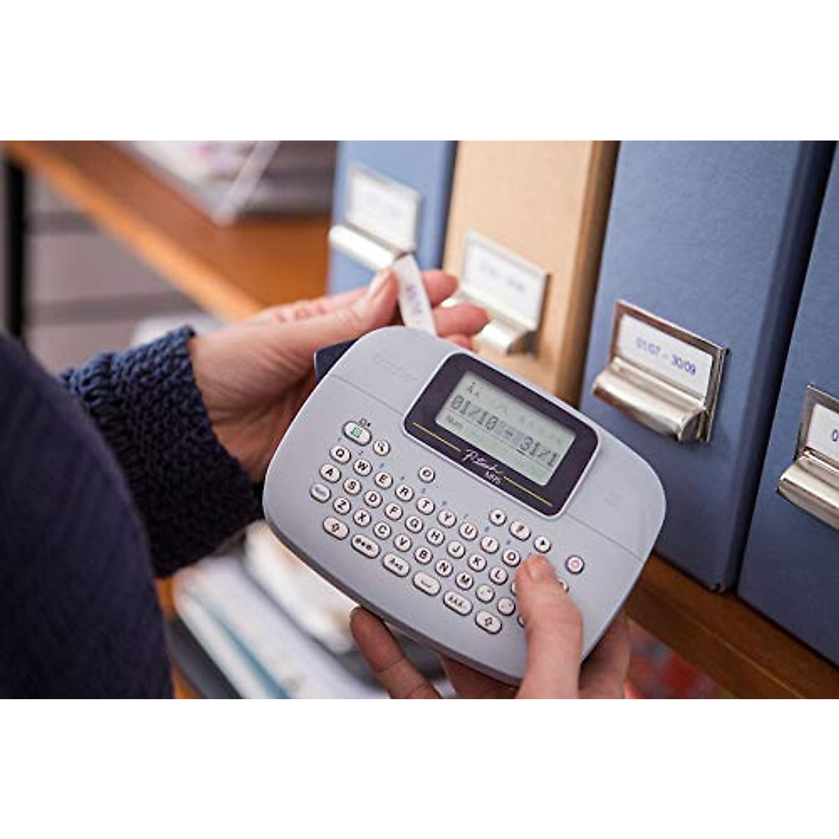 Brother PT-M95 Label Maker, P-Touch Label Printer, Handheld, QWERTY Keyboard, Up to 12mm Labels, Includes 12mm Black on White Tape Cassette