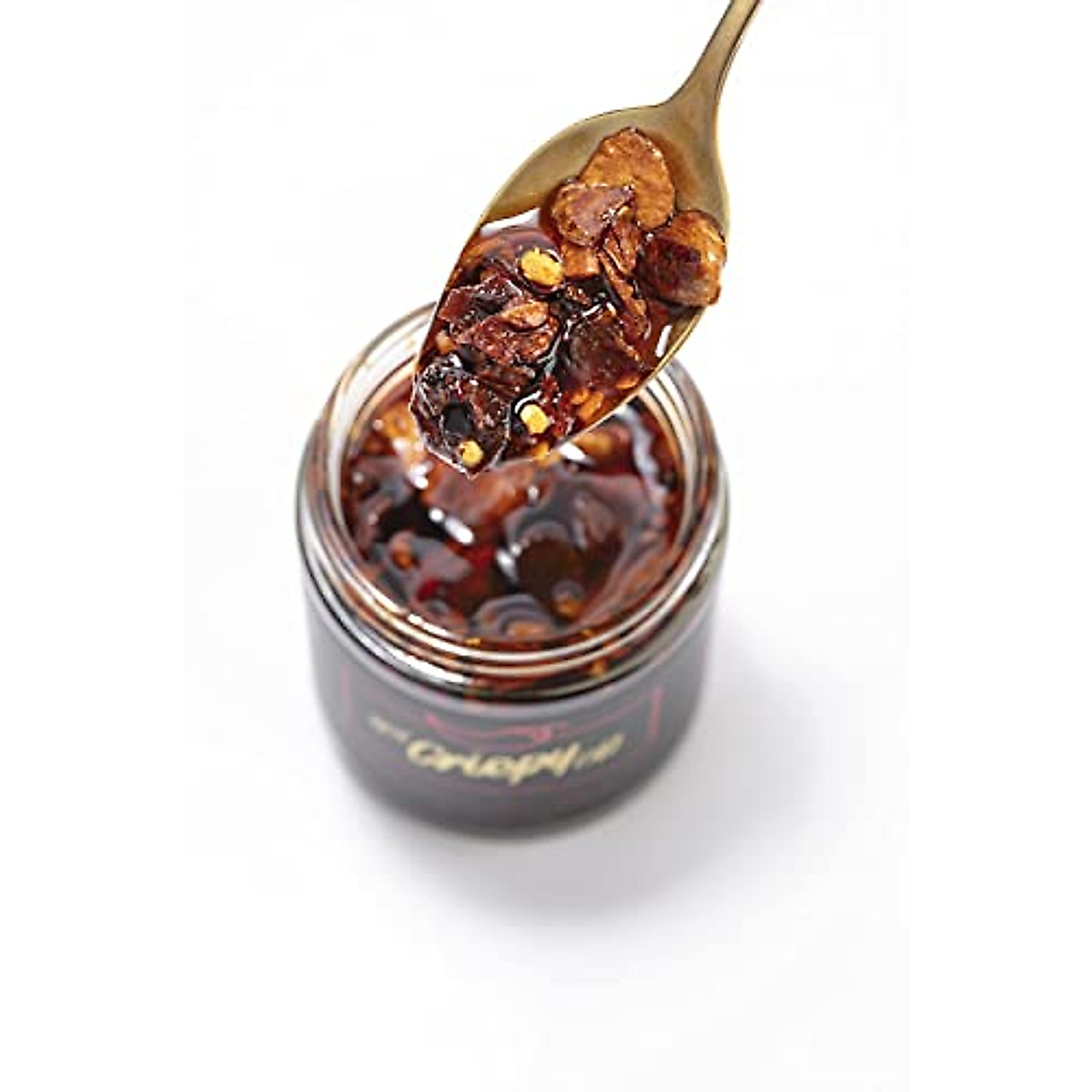 Hot Crispy Oil, An all natural unique blend of fresh fried shallots, fresh garlic and a proprietary blend of three different chili peppers. Highly addictive.