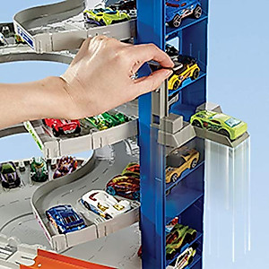 Hot Wheels Toy Car Track Set & 4 1:64 Scale Cars, Super Ultimate Garage, 3+ Ft Tall with Motorized Gorilla & Storage for 140 Cars