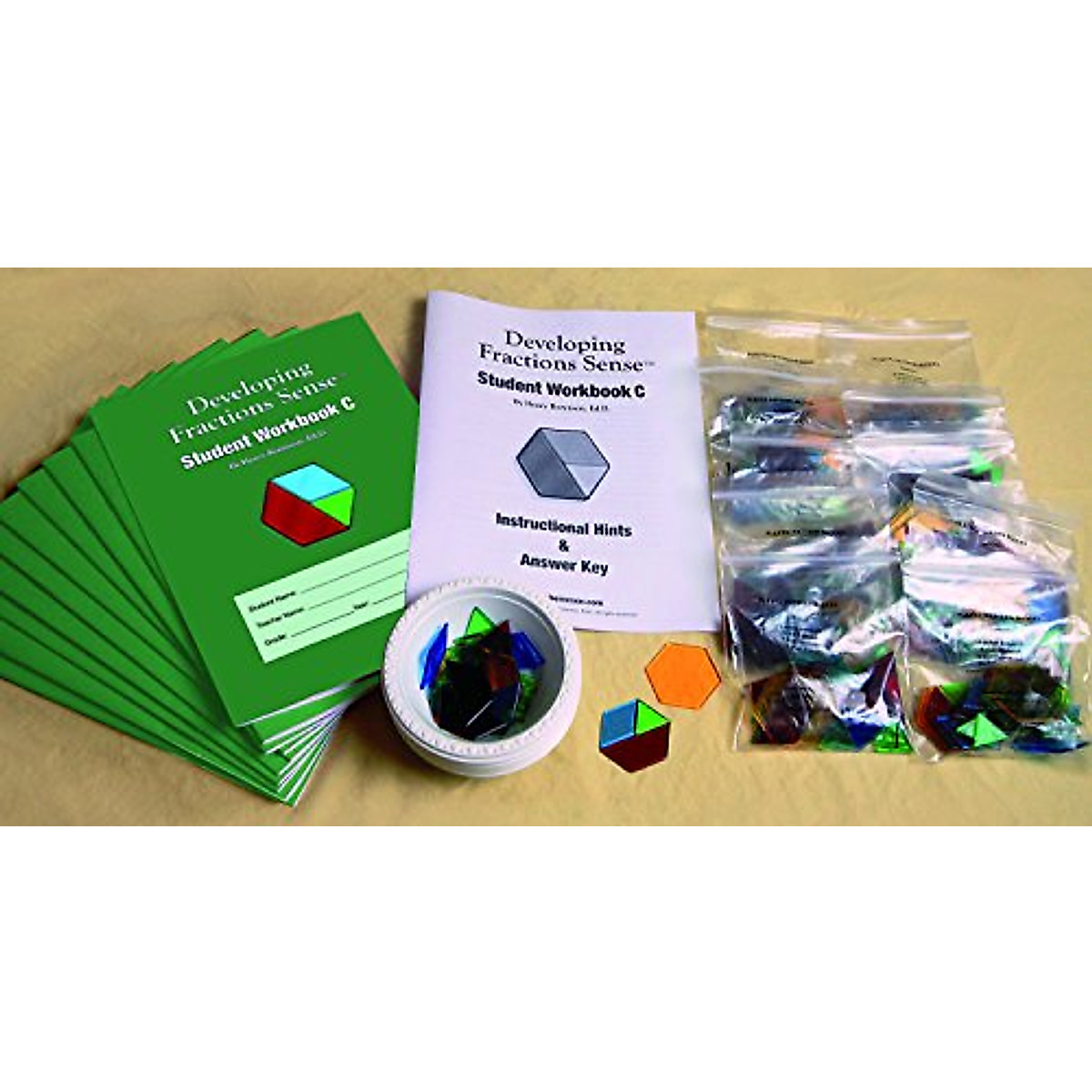 Developing Fractions Sense® C Class Set of Ten - Grade 5. A Concrete and Visual Approach to Fractions. Includes 10 Student workbooks, 10 Sets of Fraction manipulatives, Teacher Set and Answer Key.