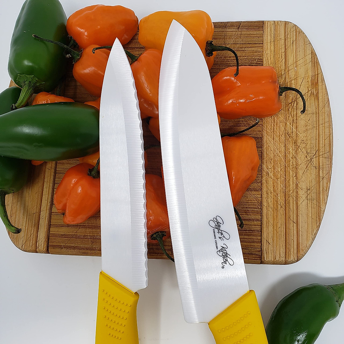 Serrated Black Ceramic Knife Set with 5" Serrated Knife. Includes 3”, 4”, 5”, 6” Ceramic Knives, Matching Sheaths and a Matching Vegetable Peeler in a Black Gift Box