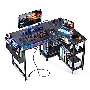 ODK 40 Inch Small L Shaped Gaming Computer Desk with Power Outlets, Corner Desk with Reversible Storage Shelves & PC Stand for Small Space, Modern Simple Home Office Table, Carbon Fiber Surface, Black