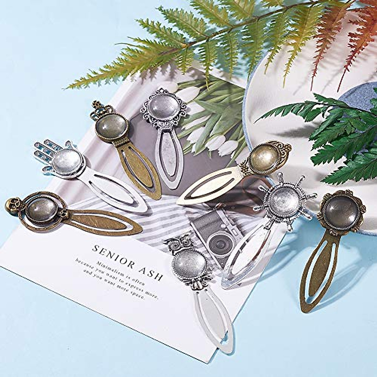 SUNNYCLUE 16Pcs 2 Colors Owl Hamsa Hand Bookmark Pendant Tray Kit Include 8pcs Metal Cabochon Bookmark Blank 8pcs Oval Round Clear Glass Cabochon Lucky Hand of Fatima Magic Style Clock Owl Bookmarks