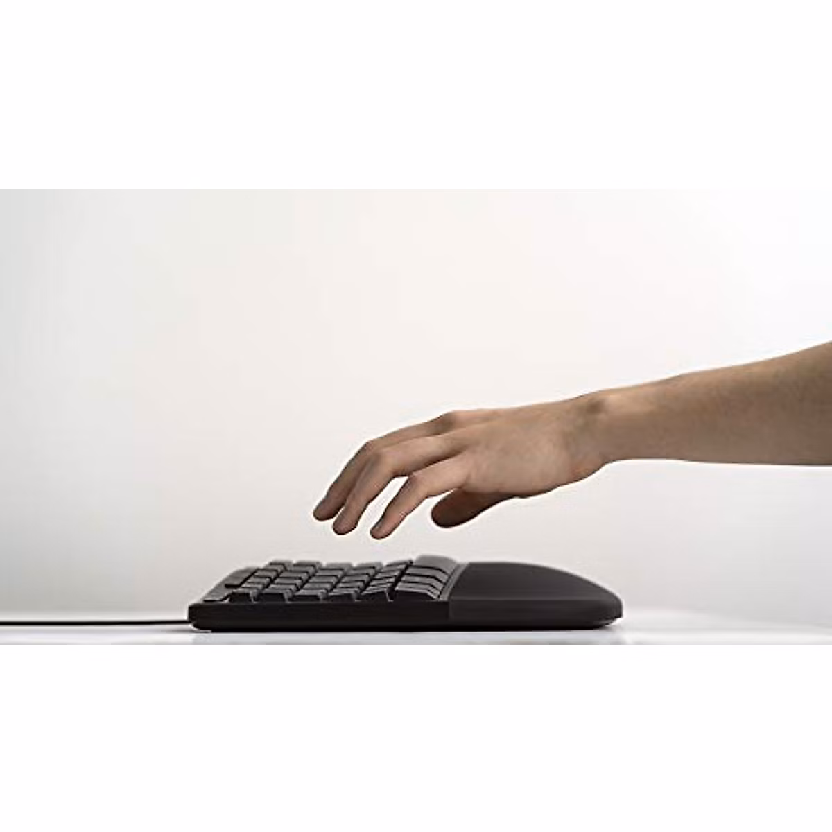 Microsoft Ergonomic Keyboard - Black. Wired, Comfortable, Ergonomic Keyboard with Cushioned Wrist and Palm Support. Split Keyboard. Dedicated Office Key.