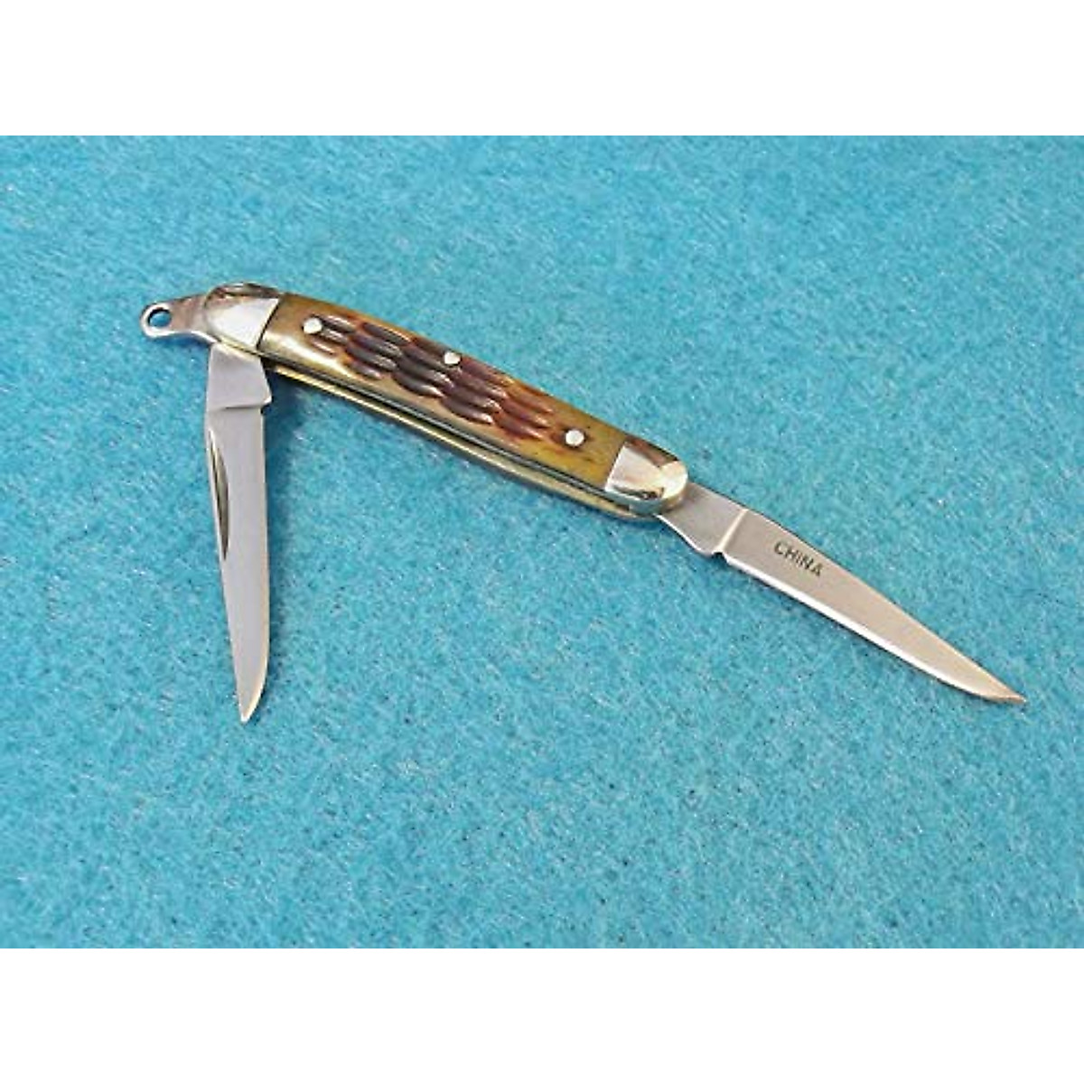 Folding Pocket Knife ROUGH RIDER RR183 Mini Muskrat Amber jigged bone Hunting Tactical Knife/bail 2 1/4" closed