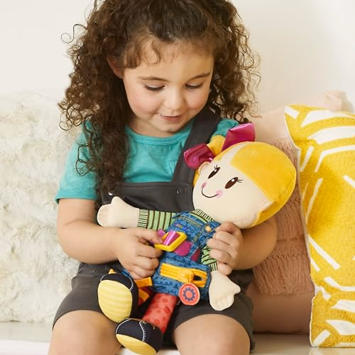 Playskool Dressy Kids Doll with Blonde Hair and Bow, Activity Plush Toy with Zipper, Shoelace, Button, for Ages 2 and Up (Amazon Exclusive)