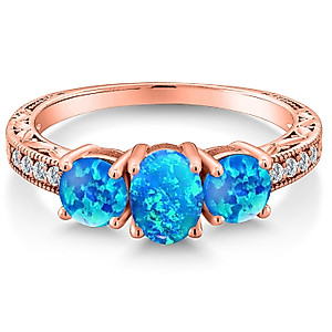 Gem Stone King 18K Rose Gold Plated Silver Oval Cabochon Blue Simulated Opal Engagement Ring For Women (1.75 Cttw, Available In Size 5, 6, 7, 8, 9)