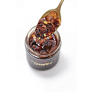 Hot Crispy Oil, An all natural unique blend of fresh fried shallots, fresh garlic and a proprietary blend of three different chili peppers. Highly addictive.