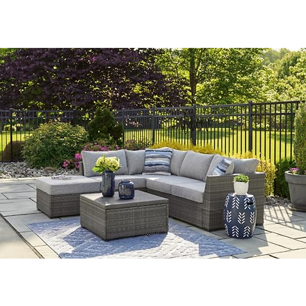 Signature Design by Ashley Petal Road Casual Weather Resistant Cushioned Outdoor Loveseat Sectional/Ottoman/Table Set with 2 Throw Pillows, Set of 4, Gray