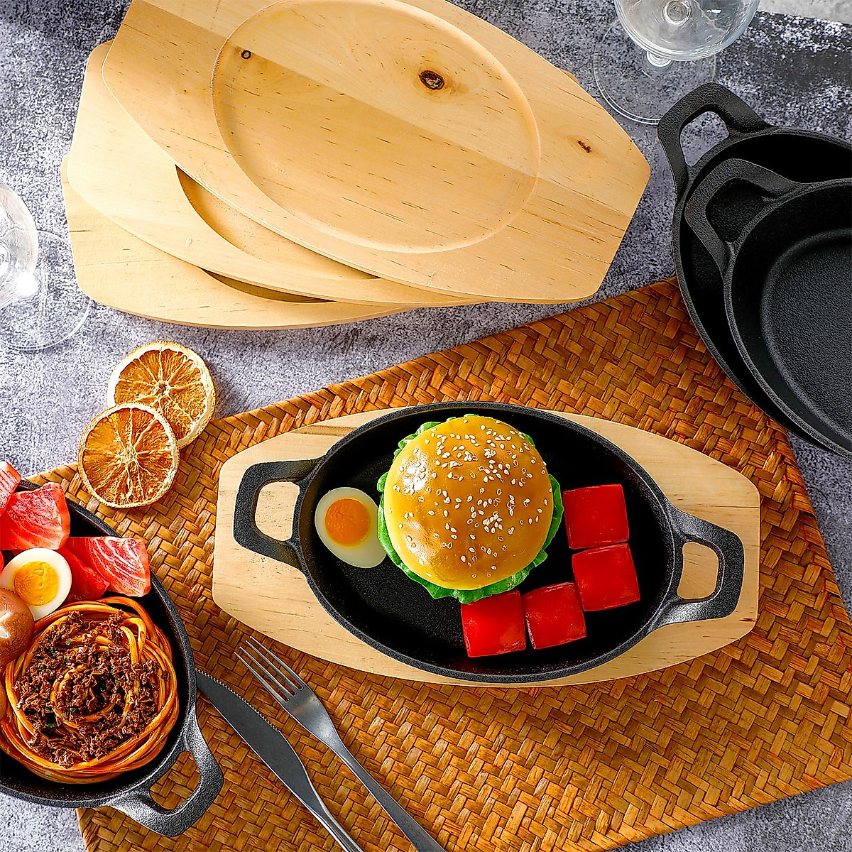 Mifoci Set of 4 Cast Iron Mini Oval Serving Dish Pans with Wooden Base 8oz Mini Cast Fajitas Iron Small Iron Skillet Dishes Black Little Pans Skillets for Baking Roasting (8.5 x 6.1 x 1.7 Inch)