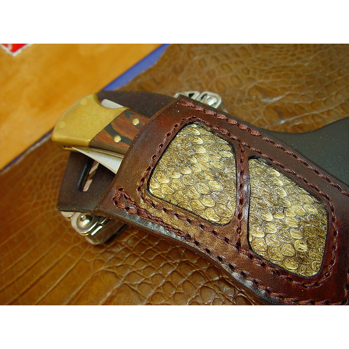 Buck 110 Rattlesnake Right-hand Cross Draw Knife Sheath. The Sheath Is Made Out of 10 Ounce Water Buffalo Leather and a Rattlesnake Insert. It is Made to Wear on Your Left-Side and Drawn with Your Right Hand the Sheath Is Dyed Dark Brown. Sheath Only the