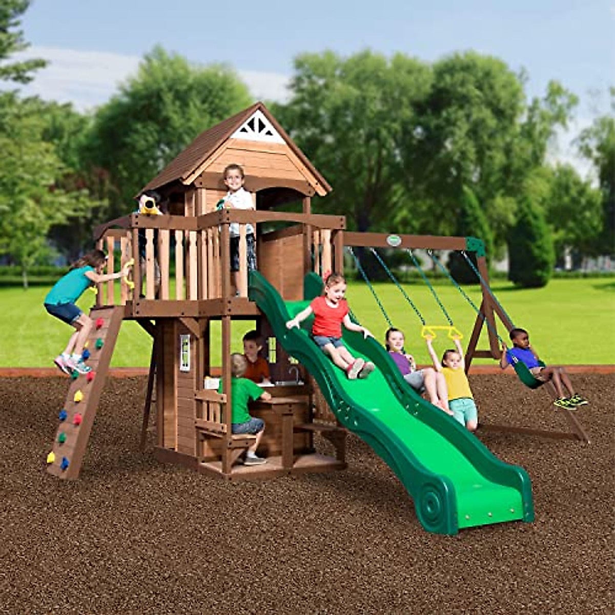 Backyard Discovery Mount Triumph All Cedar Swing Set, Covered Upper Clubhouse, Telescope, Steering Wheel, Lower Playhouse, Sink, Stove, Plastic Food, Picnic Area, Swings, Slide, Rock Climbing Wall