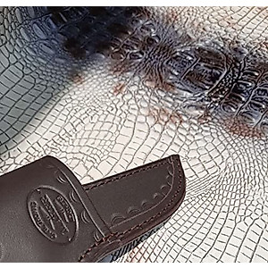 Custom Cross Draw Knife Sheath for Buck 102 Knife. The Sheath Is Made Out of 10 Ounce Water Buffalo Hide Leather the Leather Is Soft Pliable and Very Durable. This Sheath Can Be Worn on the Right or Left Hand Side. It Is Died Dark Brown with Border Toolin