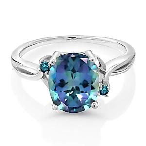 Gem Stone King 925 Sterling Silver Millennium Blue Mystic Topaz and Blue Diamond 3 Stone Ring For Women (3.03 Cttw, Oval 10X8MM, Gemstone Birthstone, Available In Size 5, 6, 7, 8, 9)