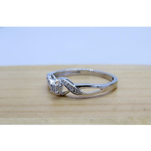 Dazzlingrock Collection Round White Diamond Crossover Swirl Promise Engagement Ring for Women (0.06 ctw, Color I-J, Clarity I2-I3) in 925 Sterling Silver Size 7