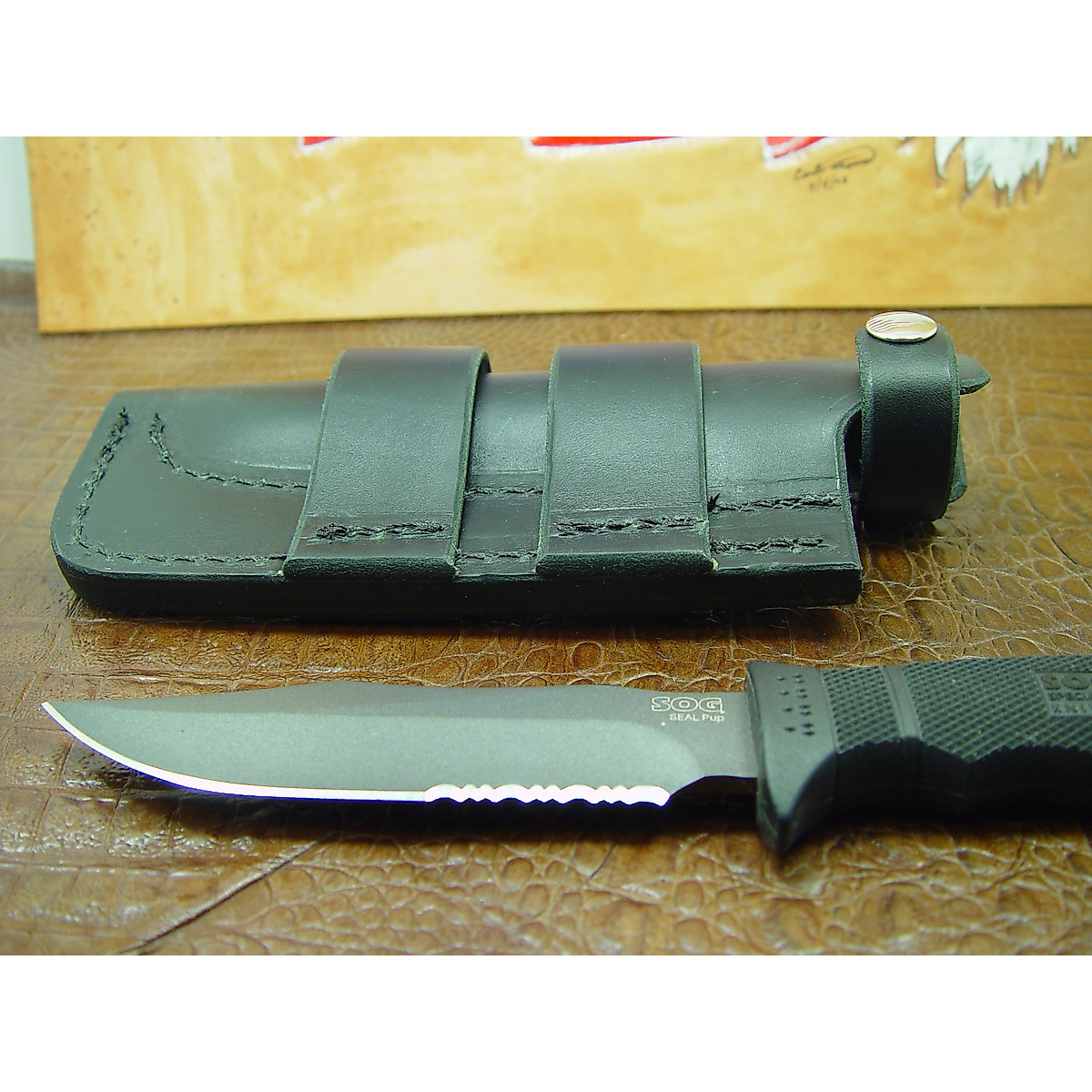 Custom Made Cross Draw Knife Sheath That Will fit The SOG Seal pup Dyed Black. A lot of Leather for The Price. Can be Worn on Left or The Right Hand Side.