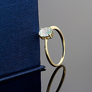 Gem Stone King 10K Yellow Gold White Simulated Opal Solitaire Engagement Ring For Women | 0.63 Cttw | Oval Cabochon 7X5MM | Gemstone October Birthstone | Available in Size 5-10
