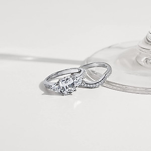 DIAMONBLISS Platinum Plated Sterling Silver 2.95 cttw Cubic Zirconia 100-Facet Bridal Ring Set (7)