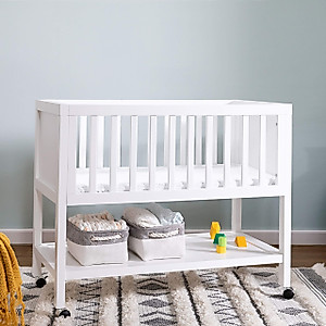 DaVinci Archie Portable Bassinet in White, Removeable Wheels, Greenguard Gold Certified